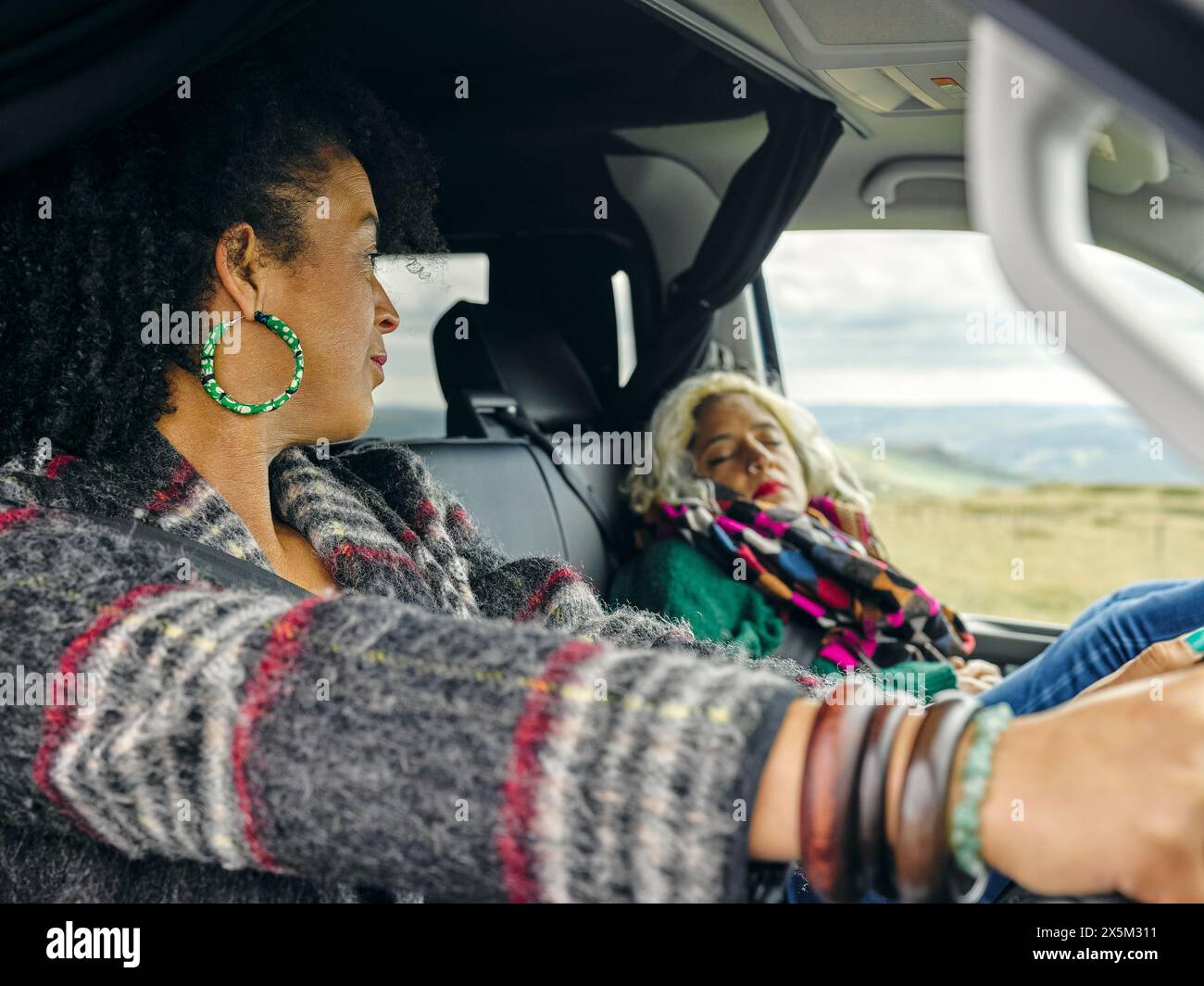 Women driving and sleeping in car Stock Photo - Alamy