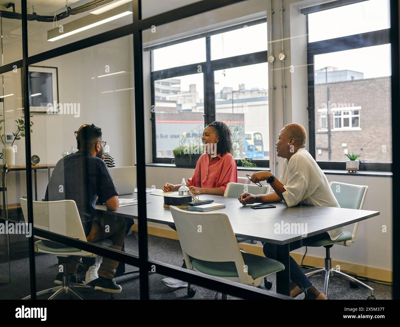 African asian female colleagues talking hi-res stock photography and ...