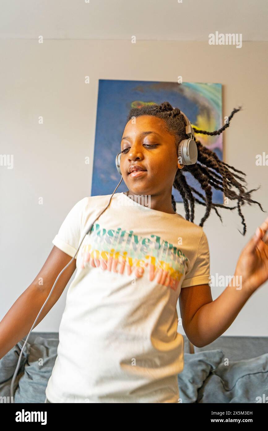Girl in headphones dancing home hi-res stock photography and images - Alamy