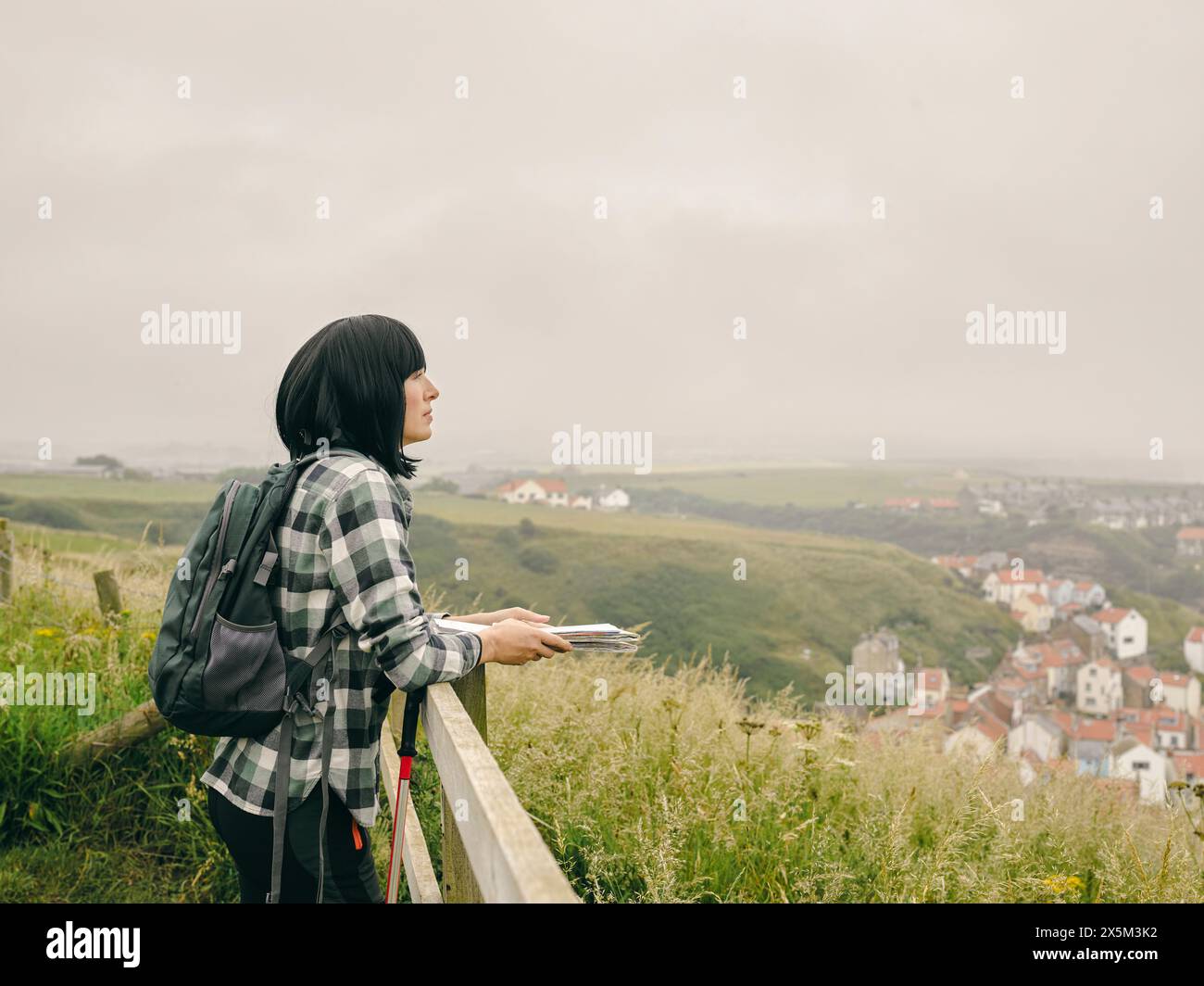 UK, Female hiker with map in landscape Stock Photo - Alamy