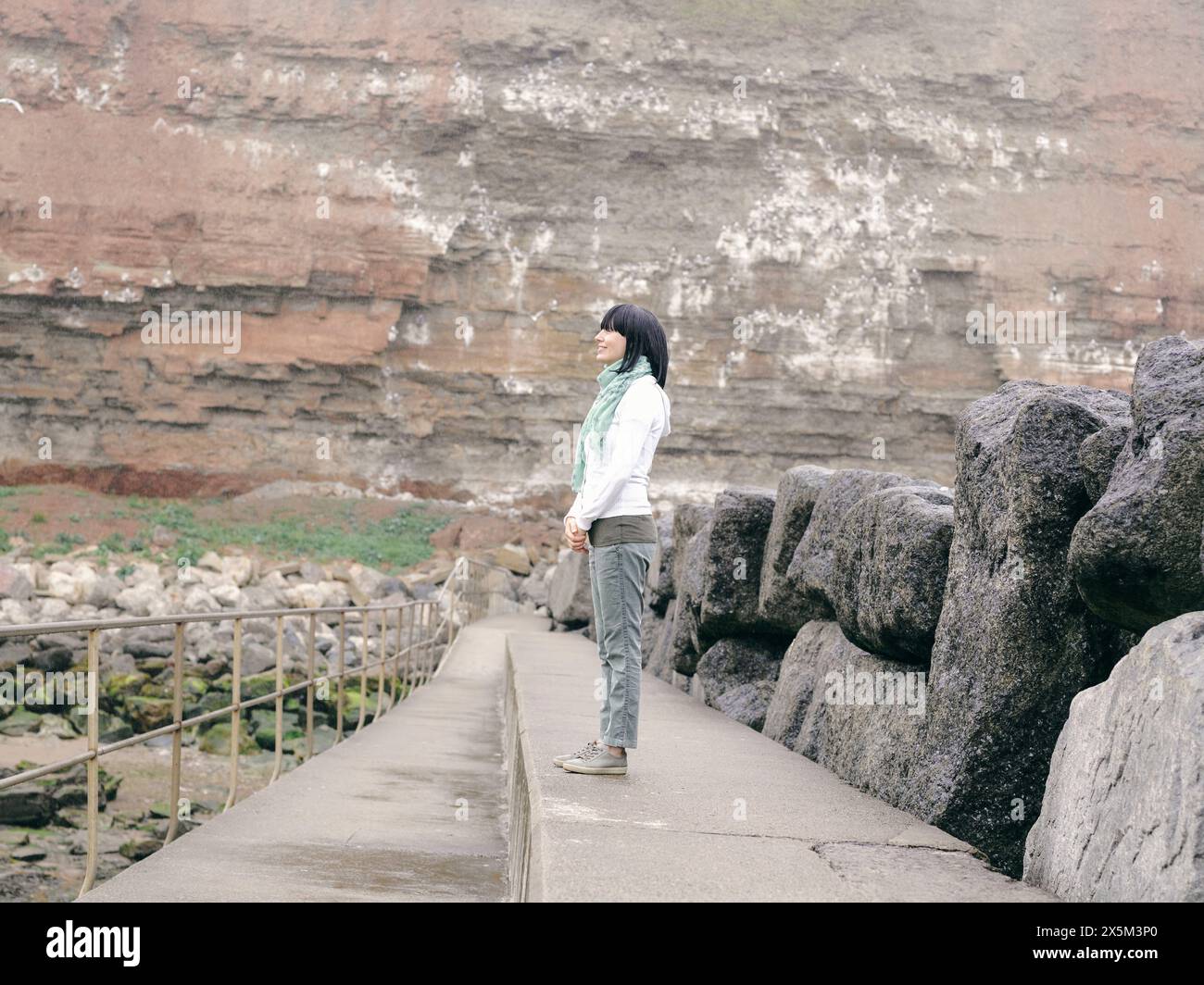 Person standing on rocky hi-res stock photography and images - Alamy