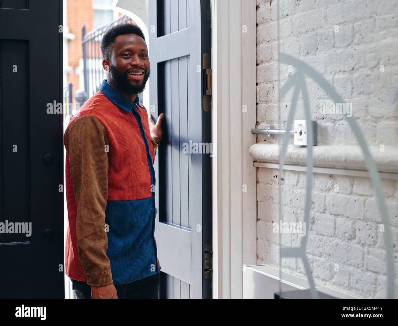Young black man entering hi-res stock photography and images - Alamy