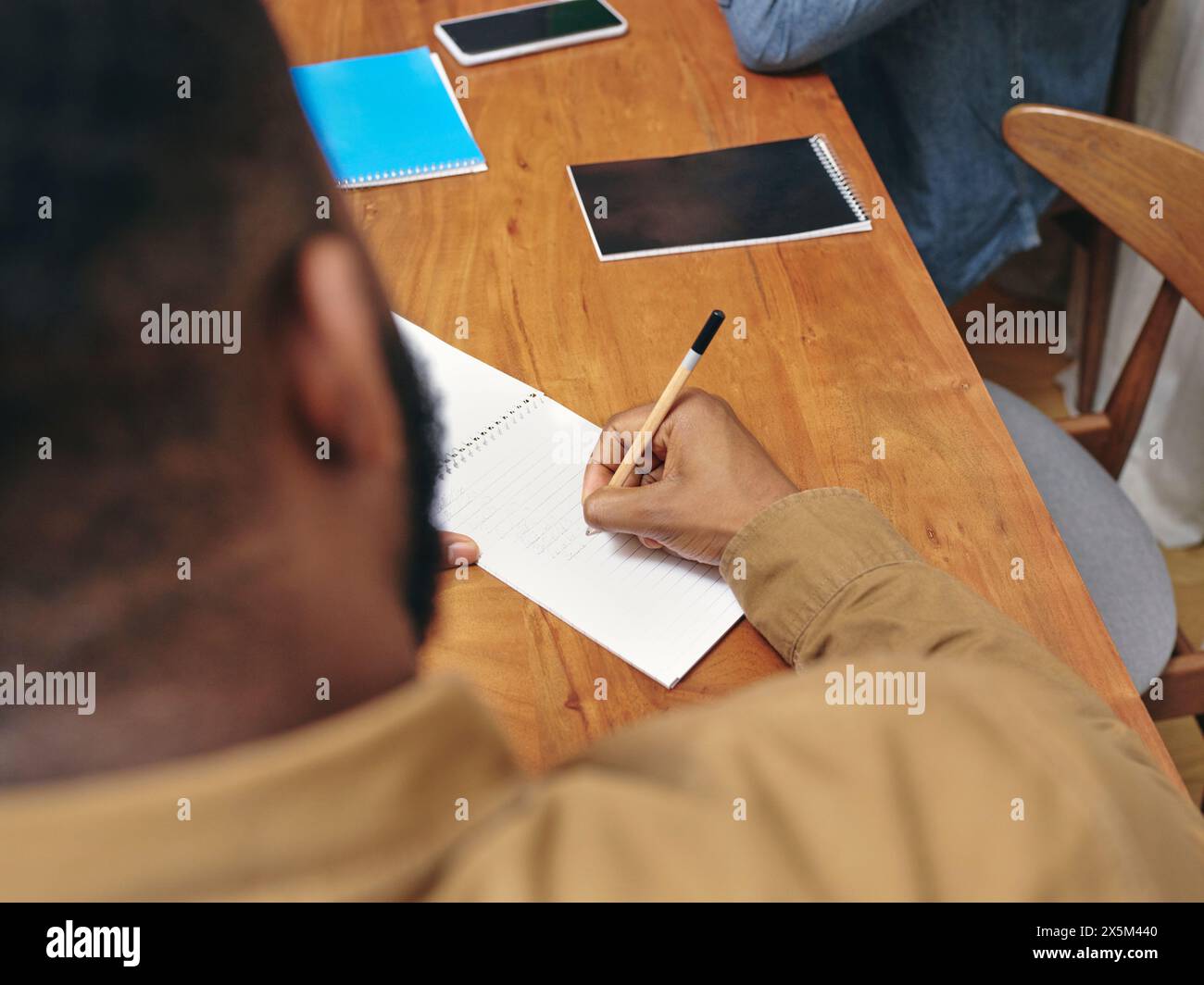 African hand writing in notepad hi-res stock photography and images - Alamy