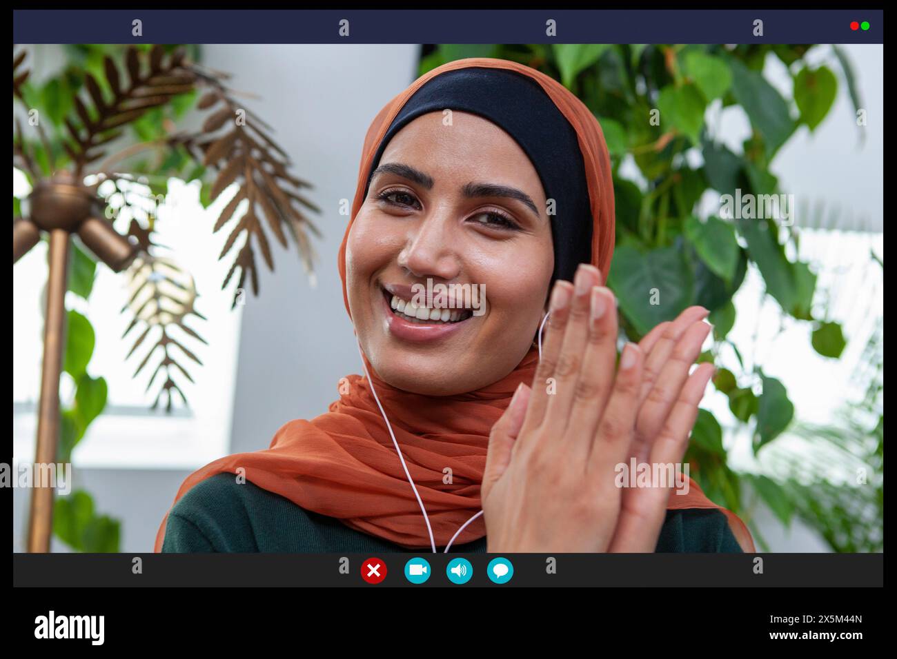 Smiling woman clapping in video call Stock Photo - Alamy
