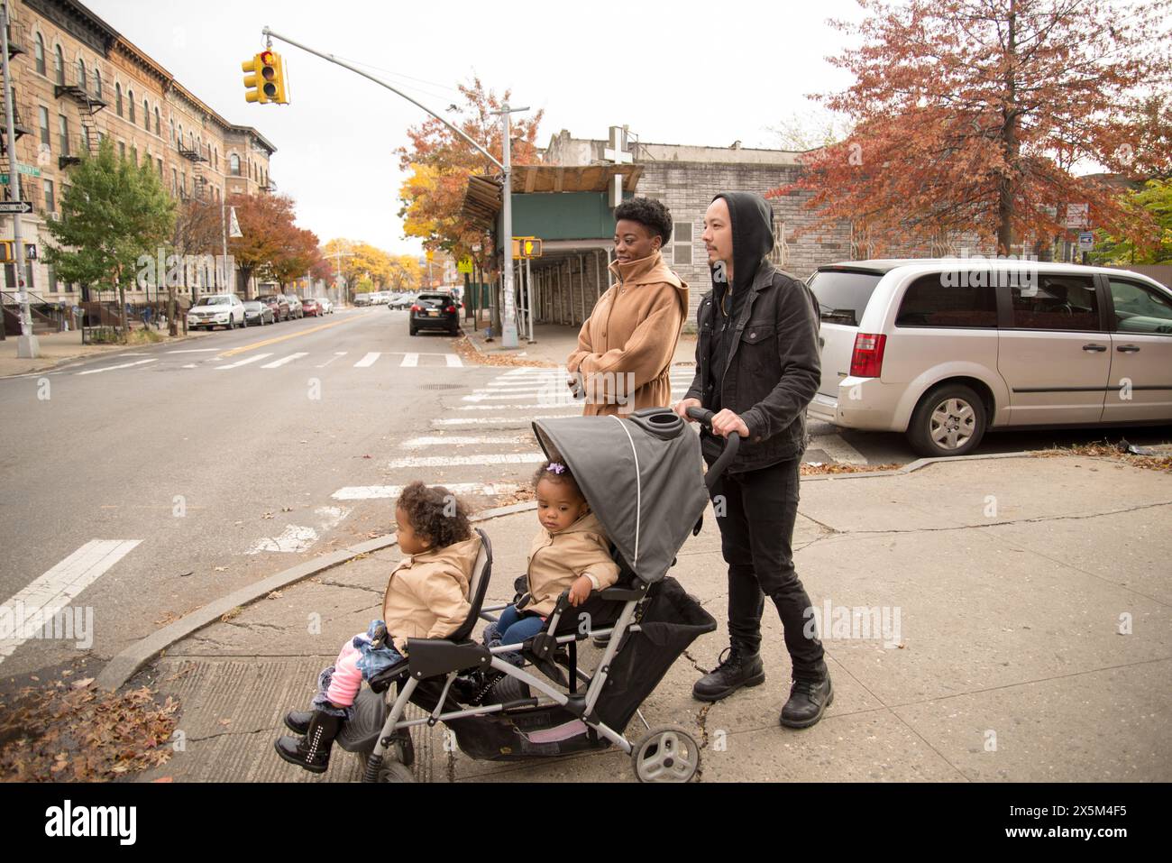 Family walking street crosswalk hi-res stock photography and images - Alamy
