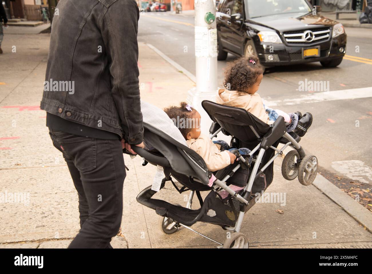 Family with stroller crossing street hi-res stock photography and ...