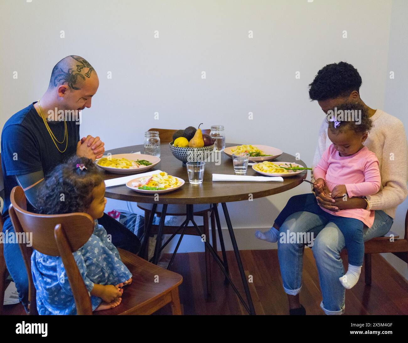 People praying before eating hi-res stock photography and images - Alamy