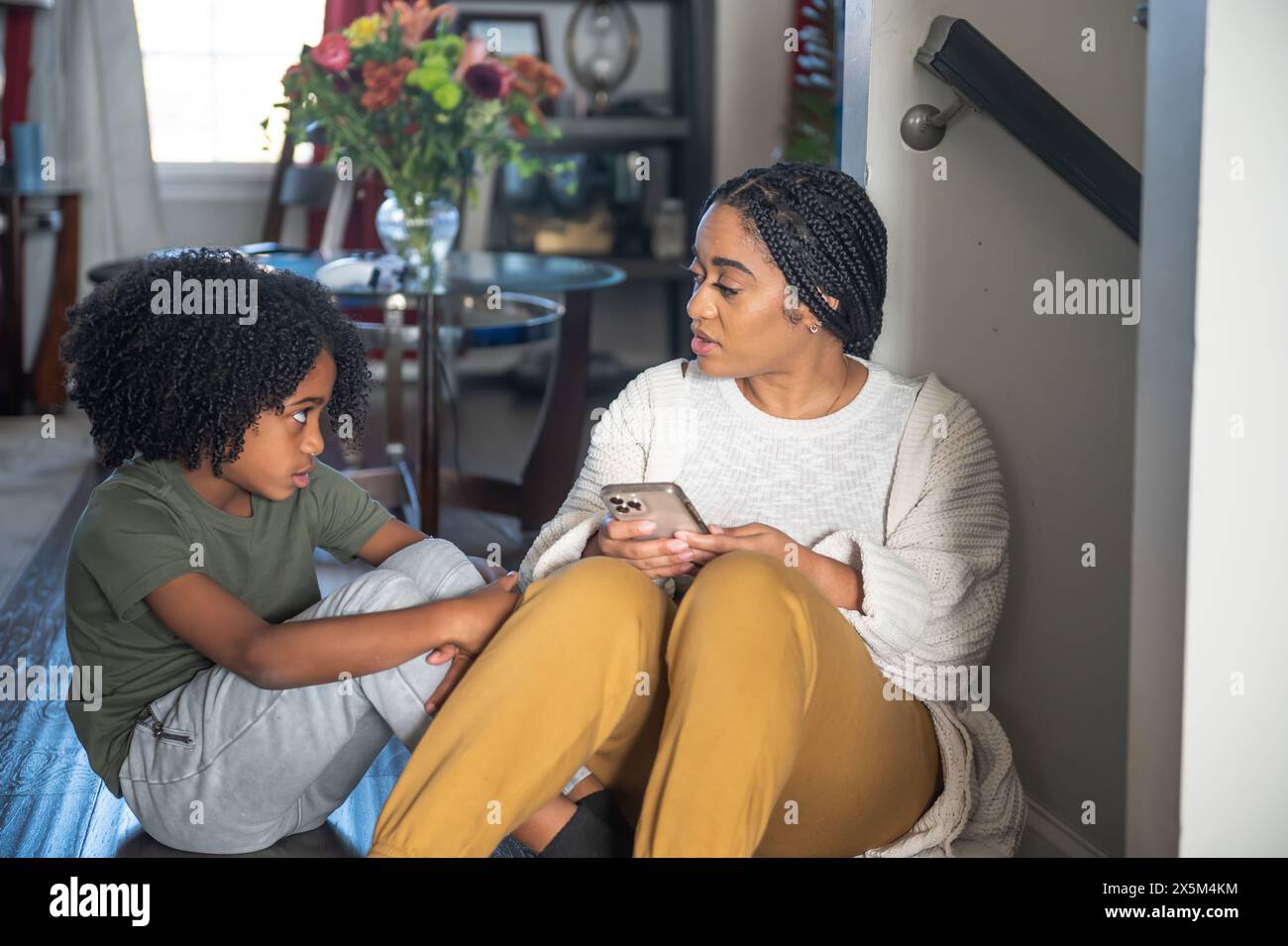 Mother talking with son at home Stock Photo - Alamy