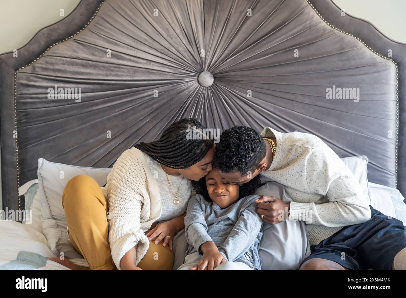 Playful family in bedroom hi-res stock photography and images - Alamy
