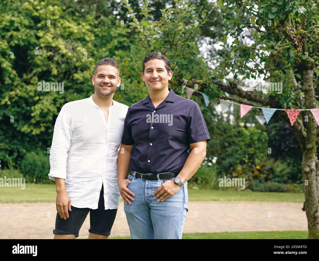 Portrait two brothers standing back hi-res stock photography and images ...