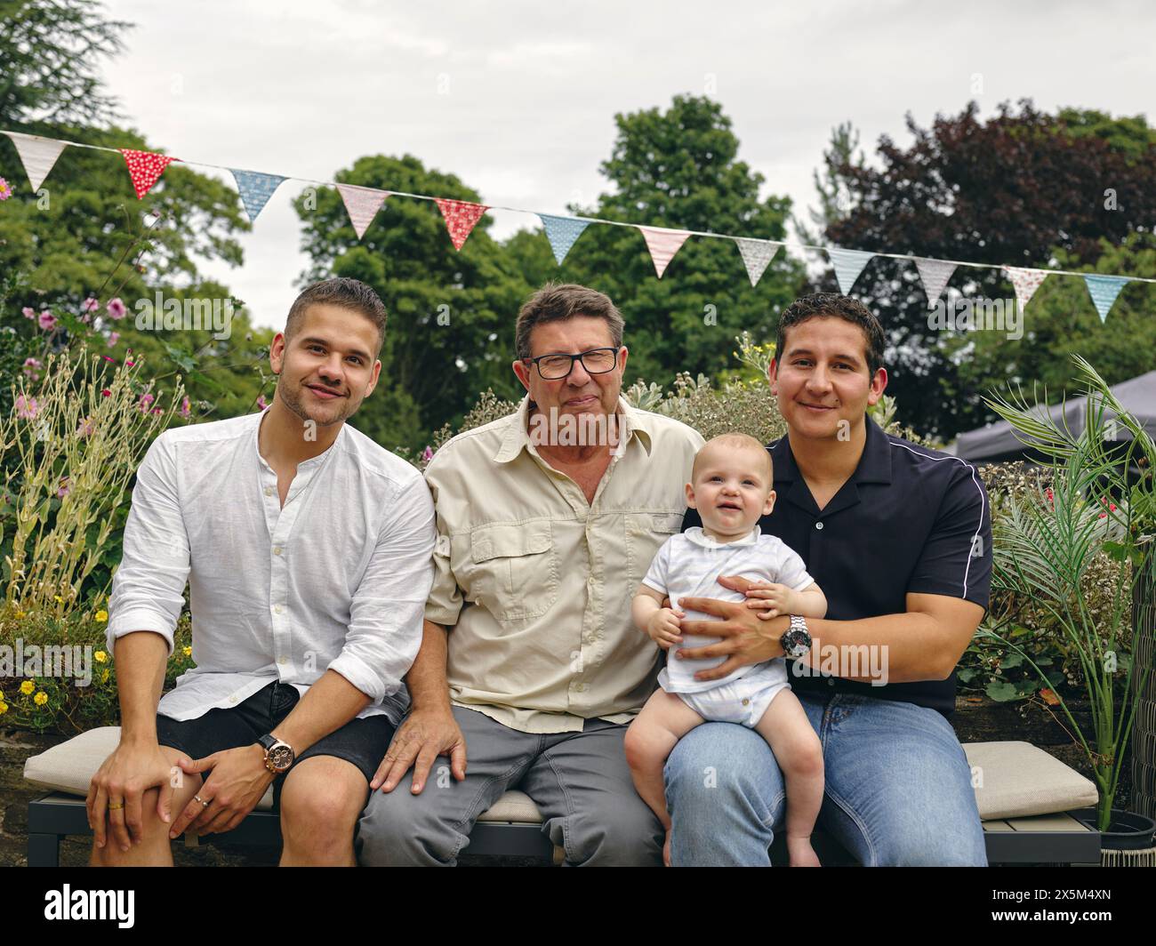 Portrait of father with sons and grandson Stock Photo - Alamy