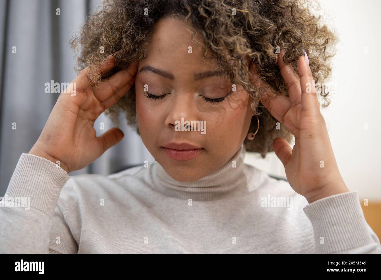 Rubbing temples hi-res stock photography and images - Alamy