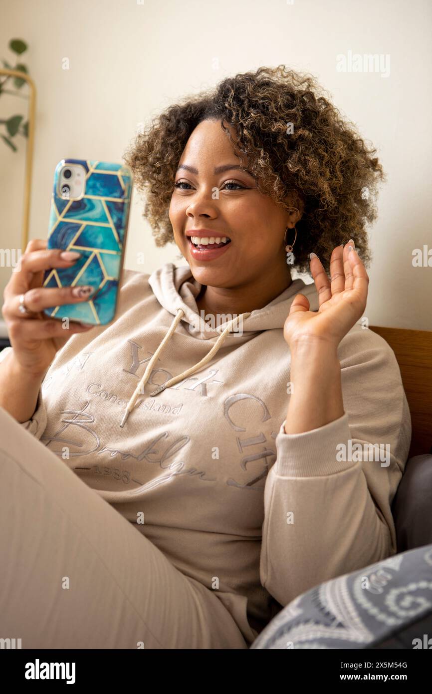 Woman having video call sitting hi-res stock photography and images - Alamy