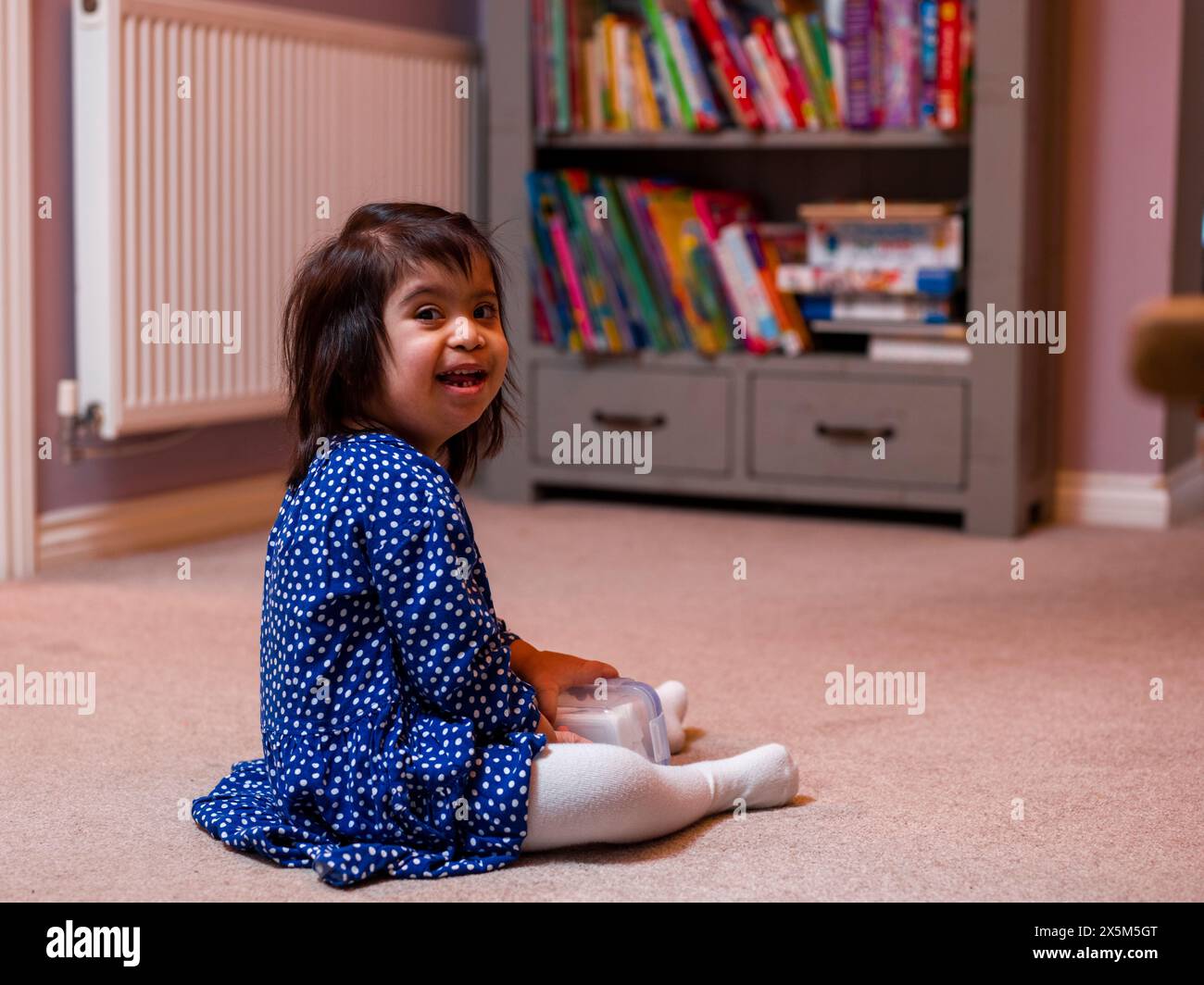 Portrait smiling girl sitting hi-res stock photography and images - Alamy