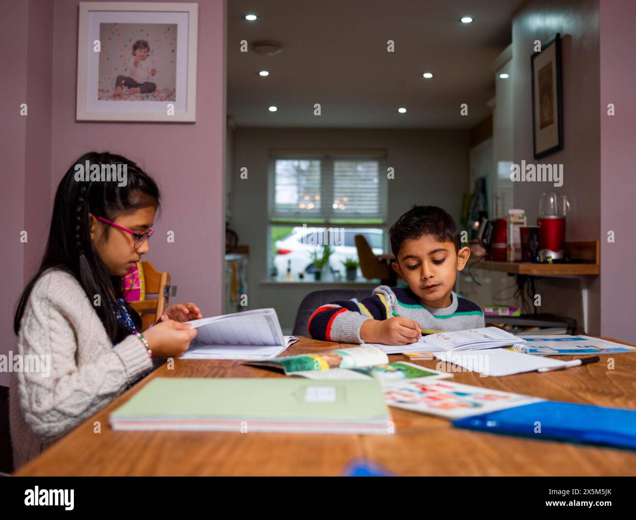 Brother sister doing homework hi-res stock photography and images - Alamy