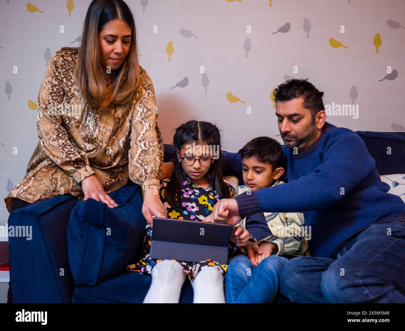 Parents bonding children tablet hi-res stock photography and images - Alamy