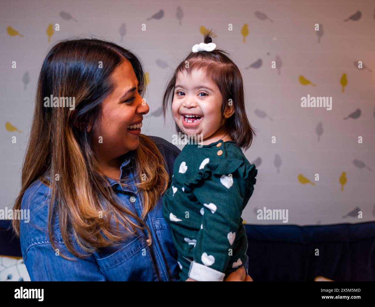 Smiling mother holding daughter Stock Photo - Alamy Smiling mother holding daughter Stock Photo - Alamy