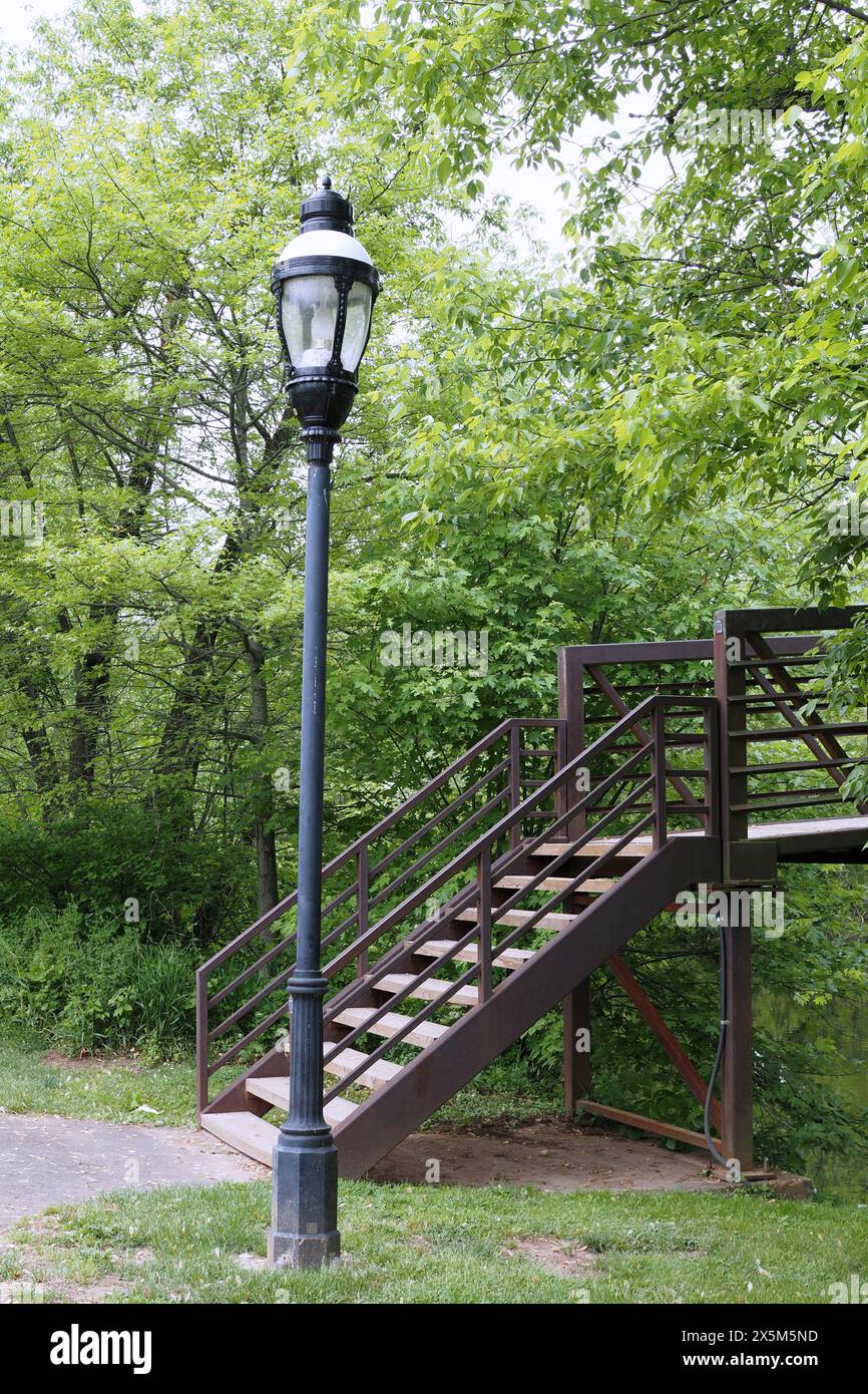 The lamp post by the steps to the footbridge Stock Photo - Alamy