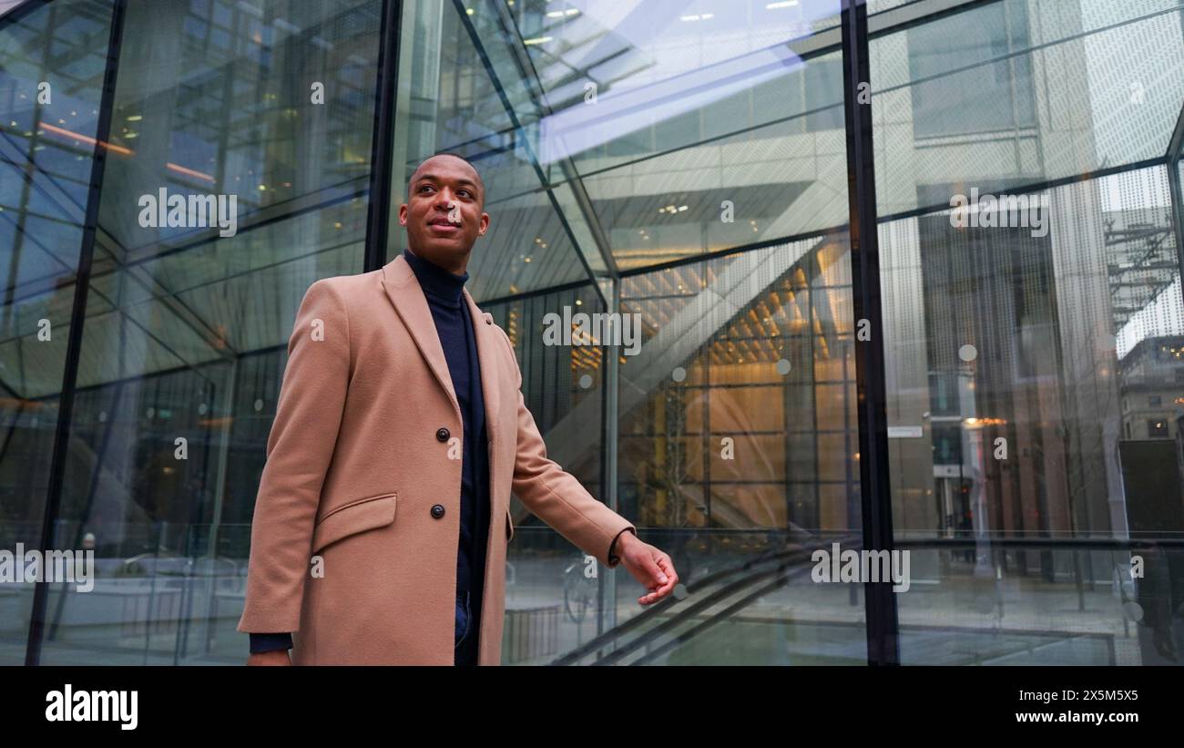 Business man outside office building Stock Photo - Alamy