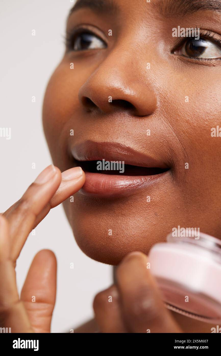 Applying lip balm hi-res stock photography and images - Alamy