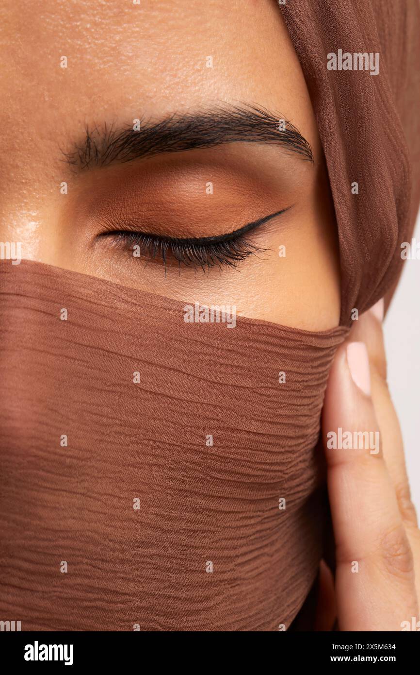 Partially closed eye hi-res stock photography and images - Alamy