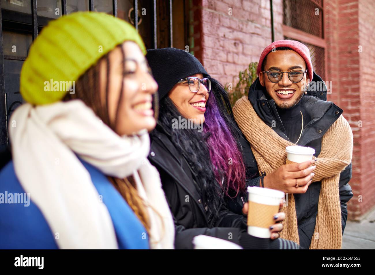 Group friends enjoying warm hi-res stock photography and images - Alamy