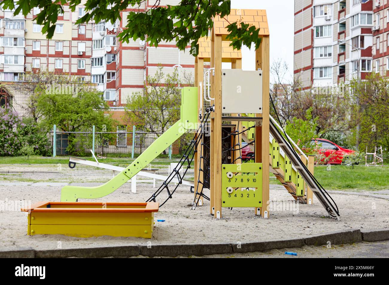 Colorful playground on yard with no children. Play yard with sandbox ...
