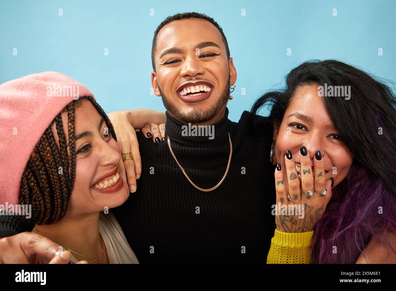 Studio portrait of smiling friends Stock Photo - Alamy