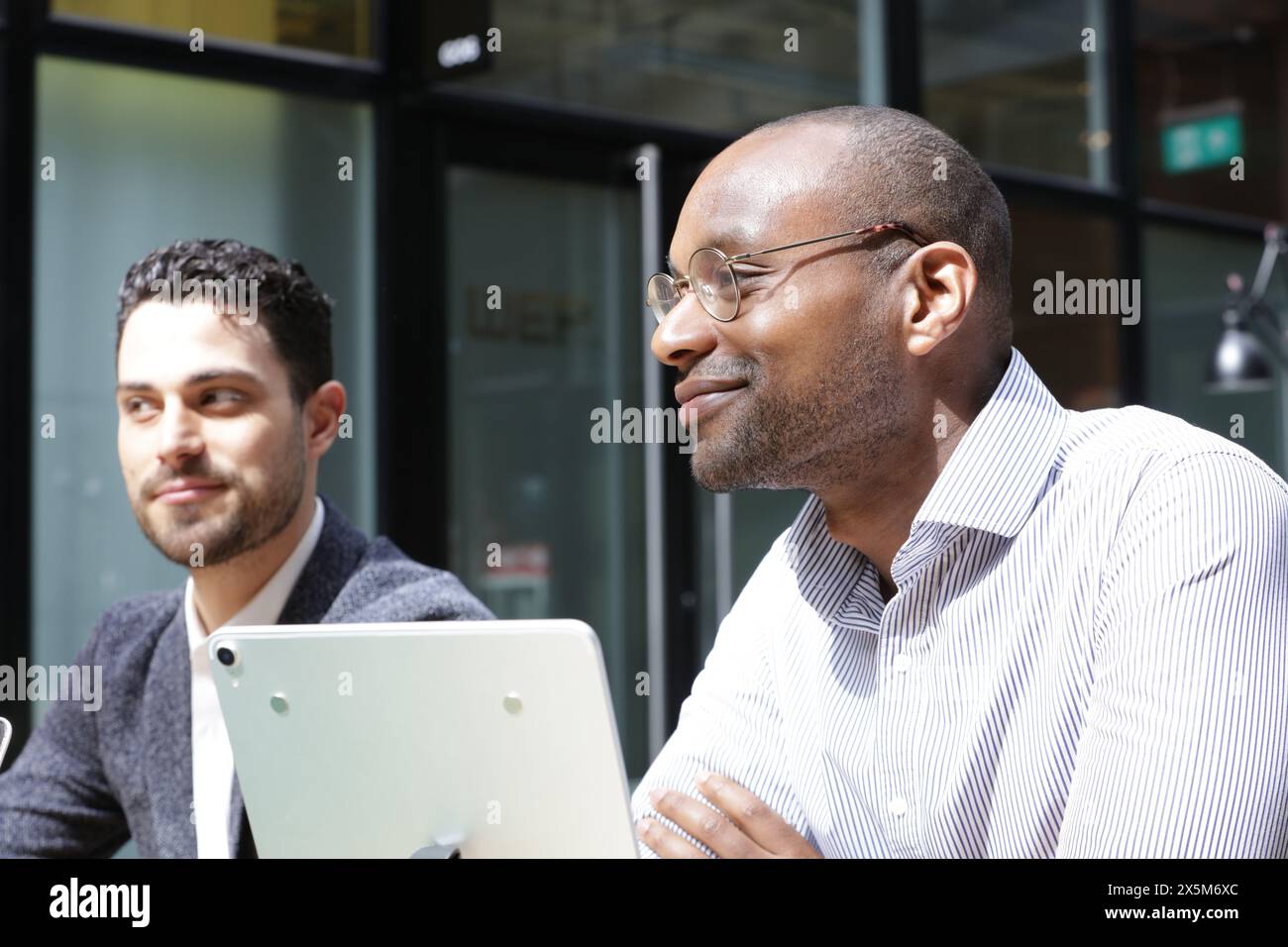 Businessmen at business meeting Stock Photo - Alamy