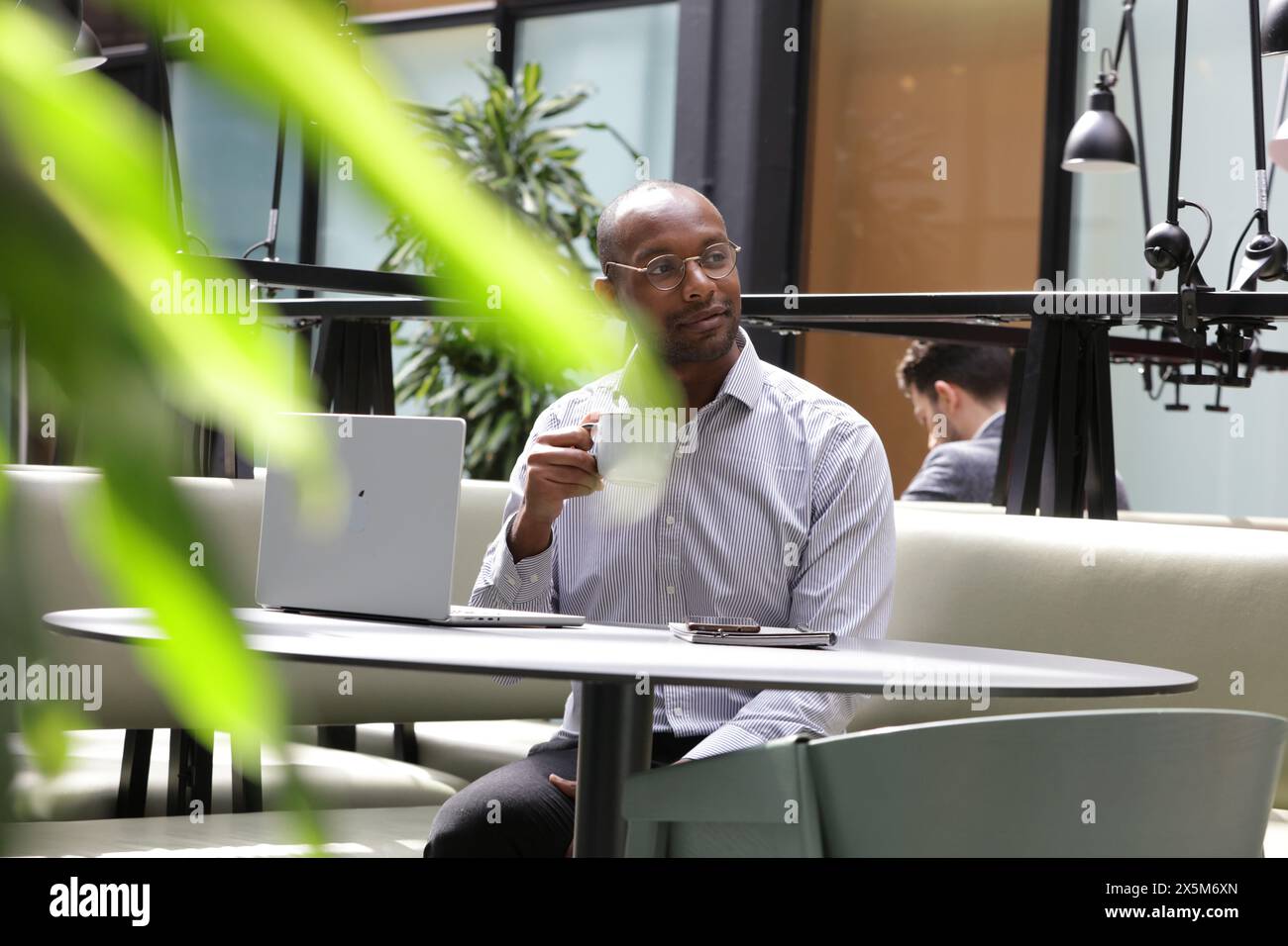 Man drinking coffee office hi-res stock photography and images - Alamy