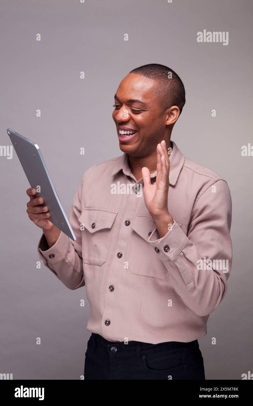 Man waving hi-res stock photography and images - Alamy