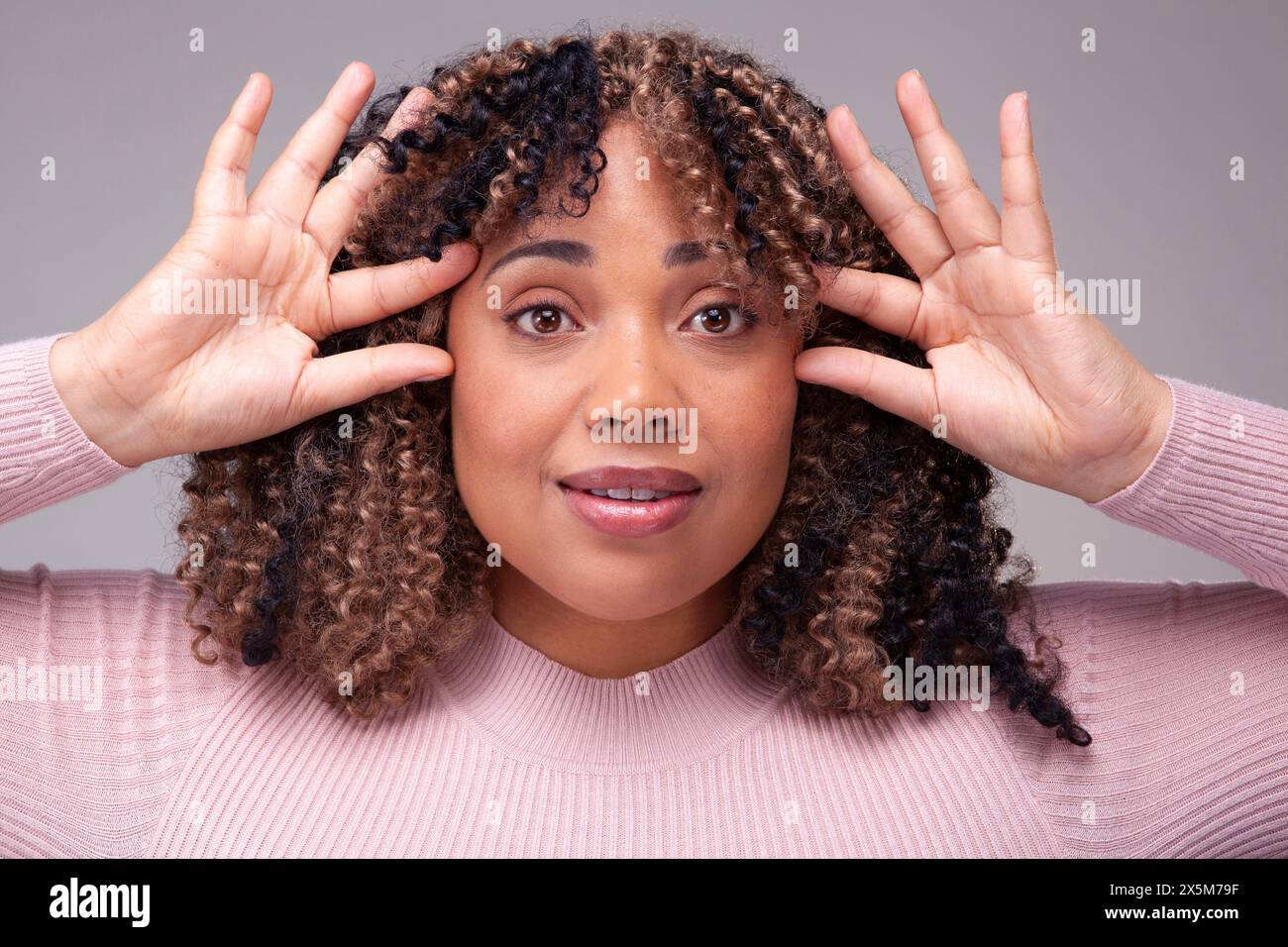 Portrait surprise woman touching hi-res stock photography and images ...