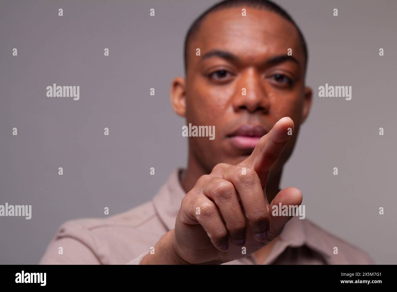 Portrait african man pointing camera hi-res stock photography and ...