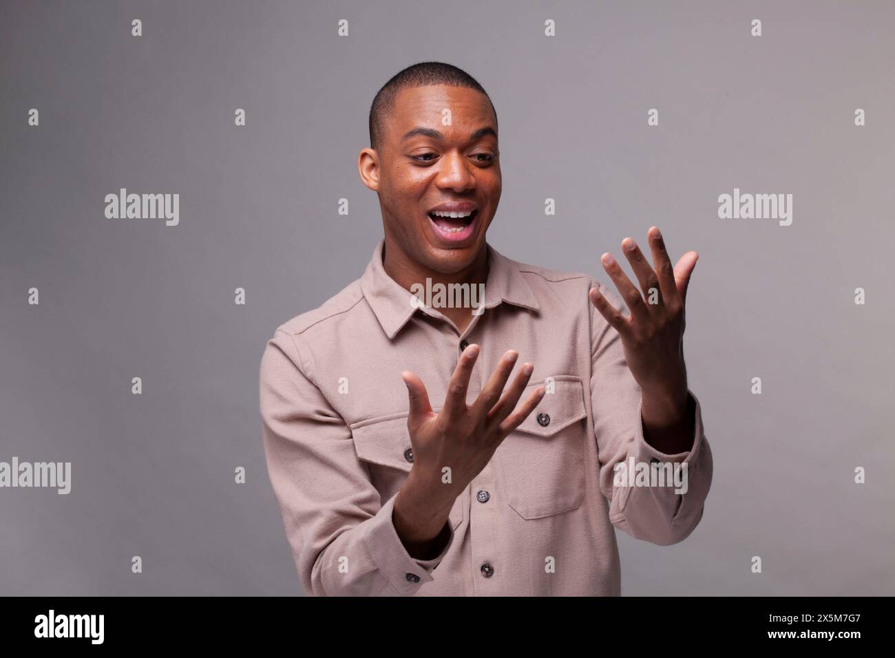 Person smiling gesturing hands hi-res stock photography and images - Alamy