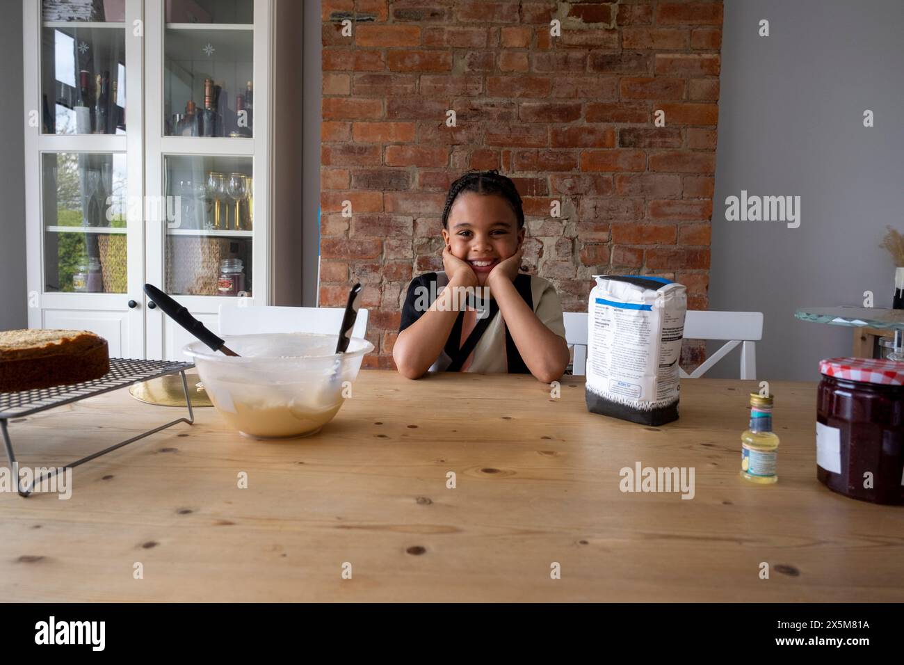 Boy sitting on kitchen hi-res stock photography and images - Alamy