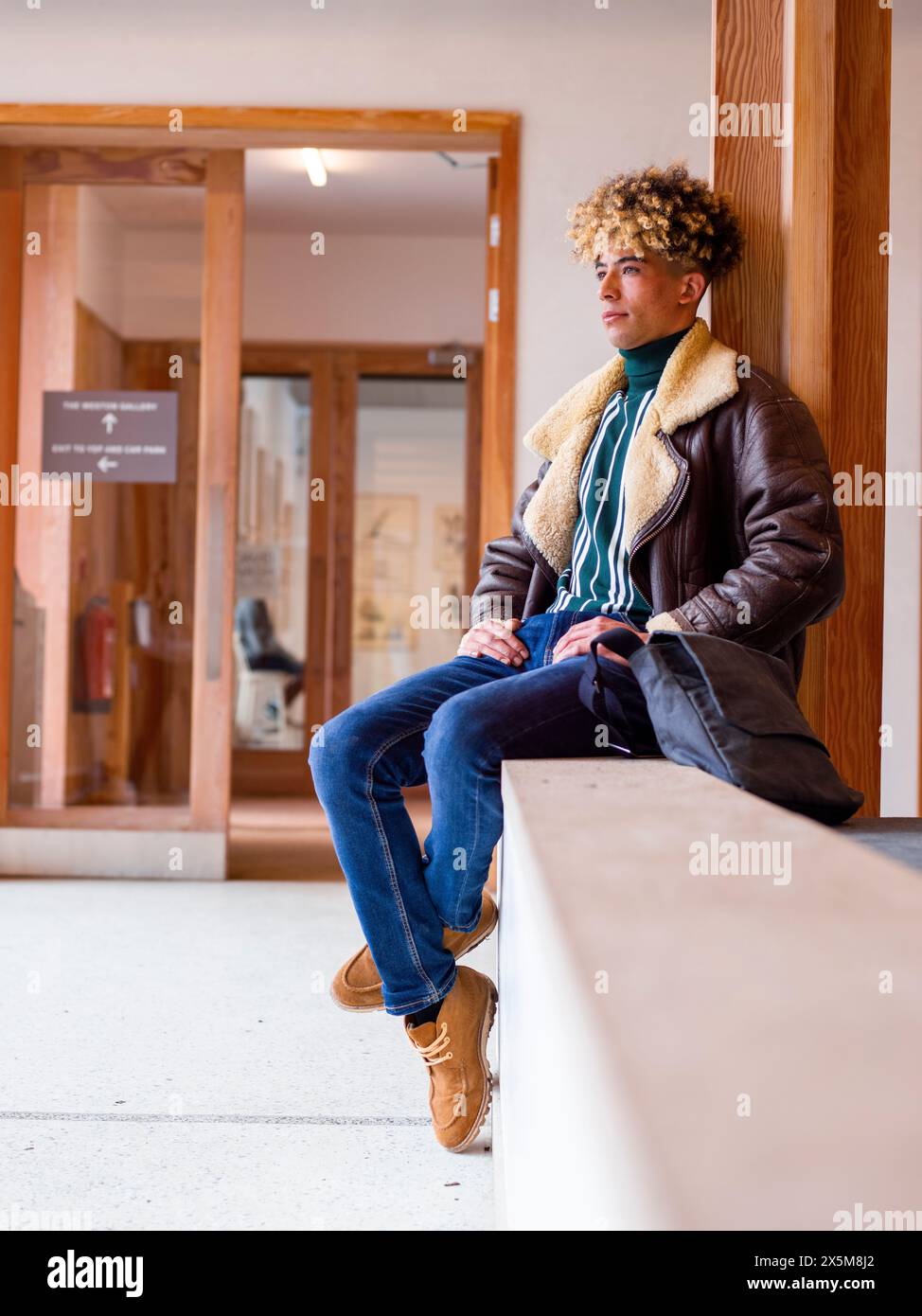 Curly young man in hi-res stock photography and images - Alamy