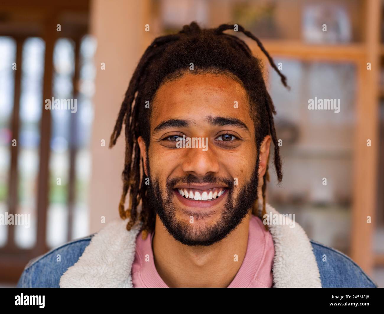 Portrait of young man with dreadlocks Stock Photo - Alamy