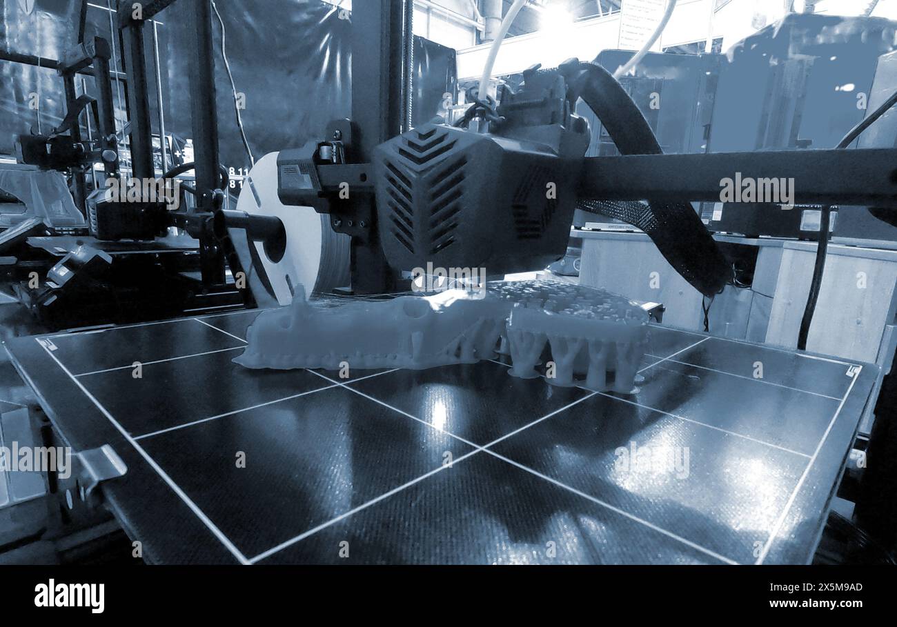 Abstract object printing on 3D printer with molten plastic close-up. 3D ...