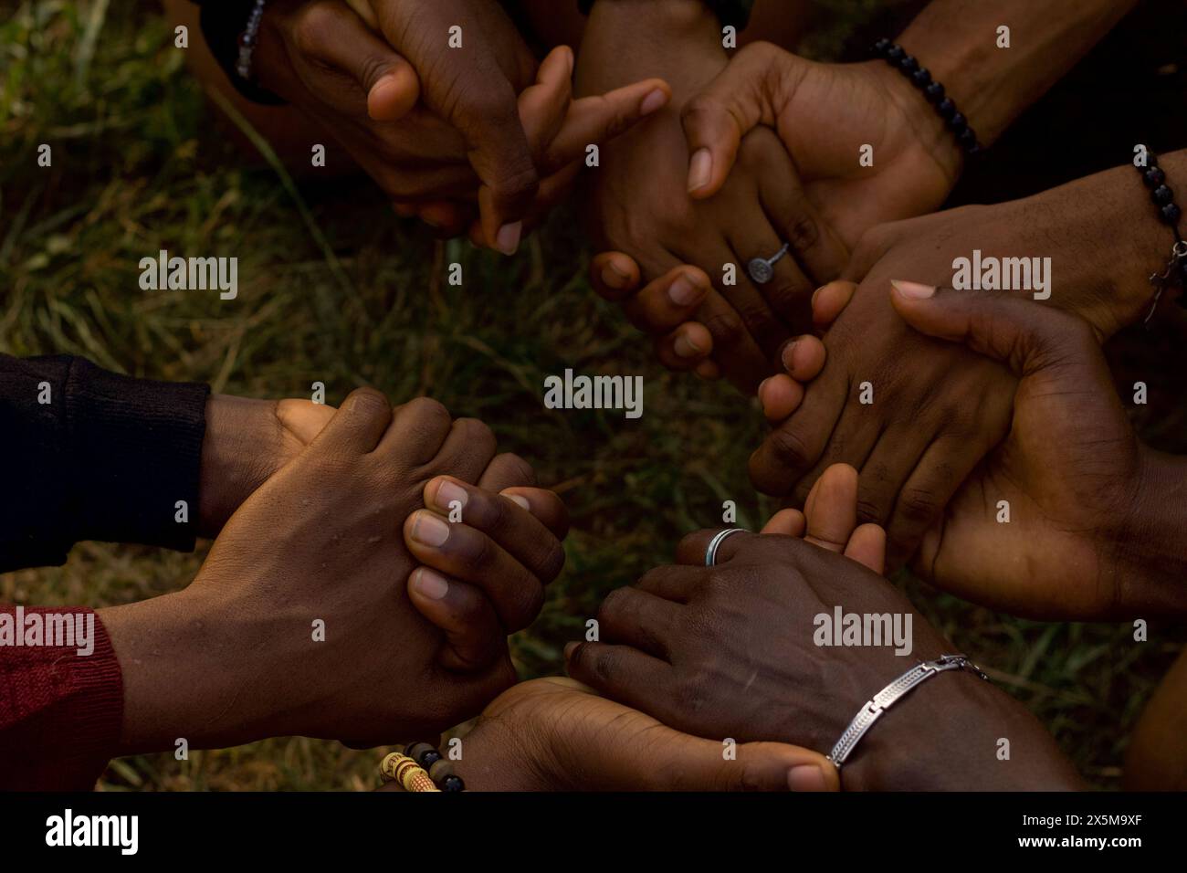 Close-up of people holding hands Stock Photo - Alamy