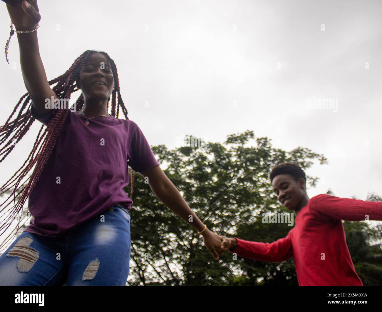 Group of young friends dancing, low angle view Stock Photo - Alamy