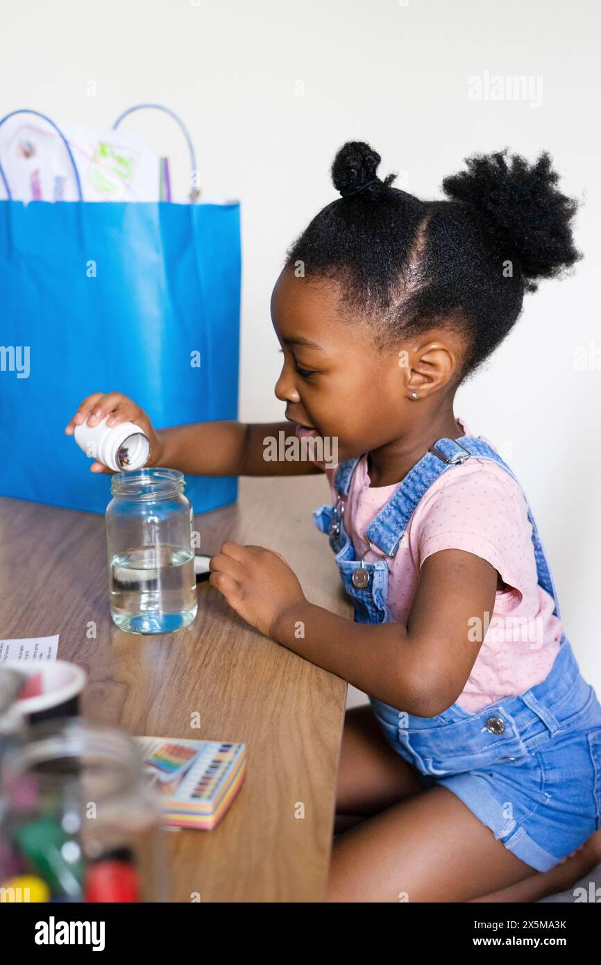 Girl doing DIY project Stock Photo - Alamy