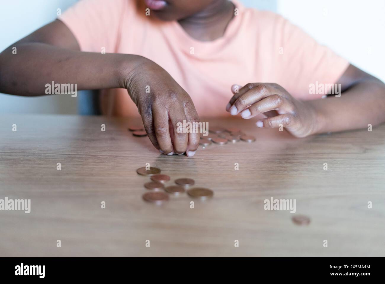 Boy counting coins Stock Photo - Alamy