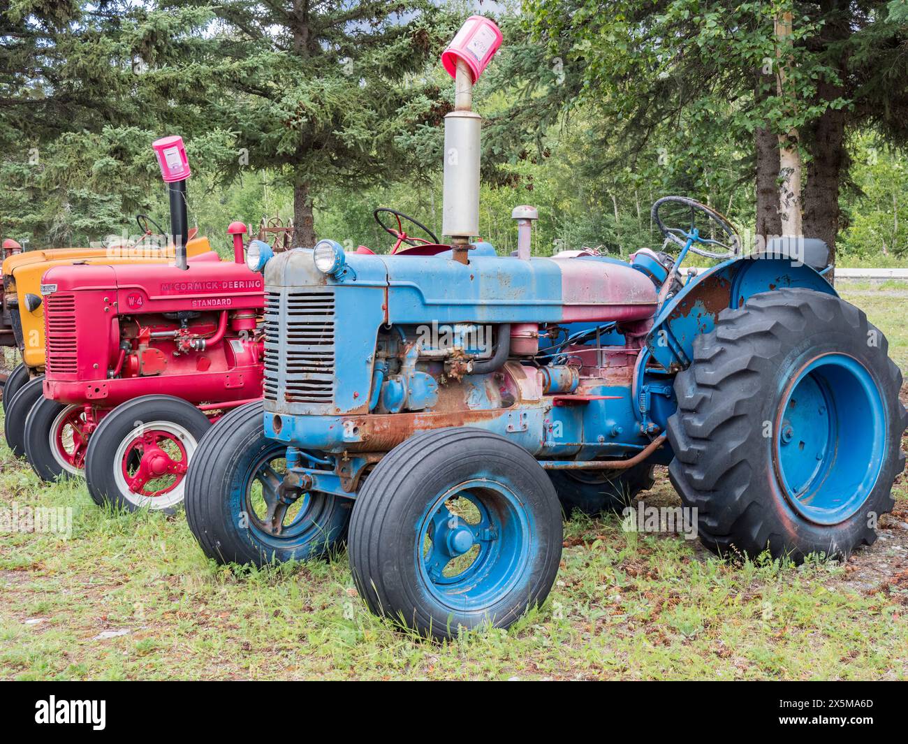 USA, Alaska. Old colorful antique tractors in a field. (Editorial Use ...