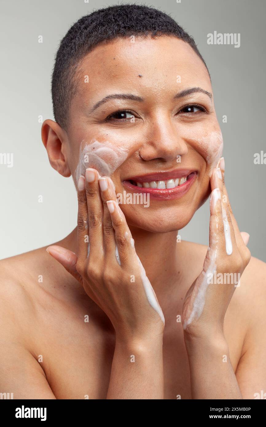 Woman portrait hand skincare hi-res stock photography and images - Alamy