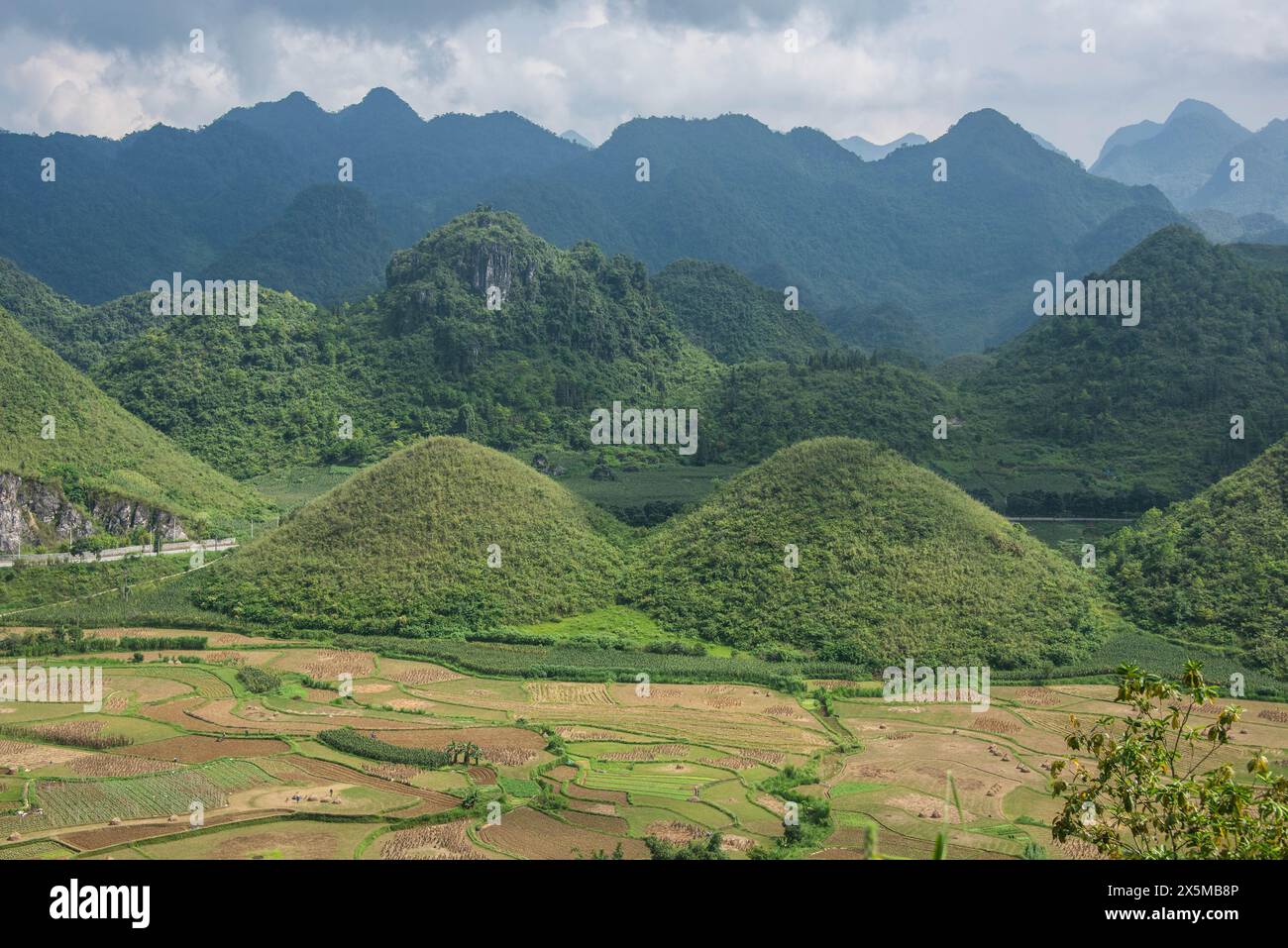 View of the Twin Mountains and limestone karst plateau from Quan Ba ...