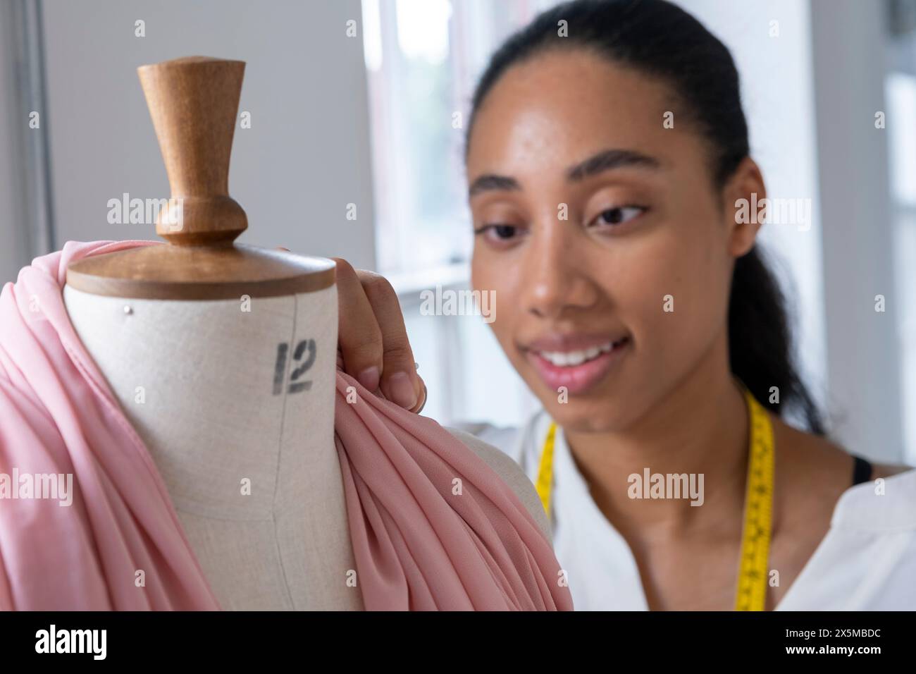 Female fashion designer at work Stock Photo - Alamy
