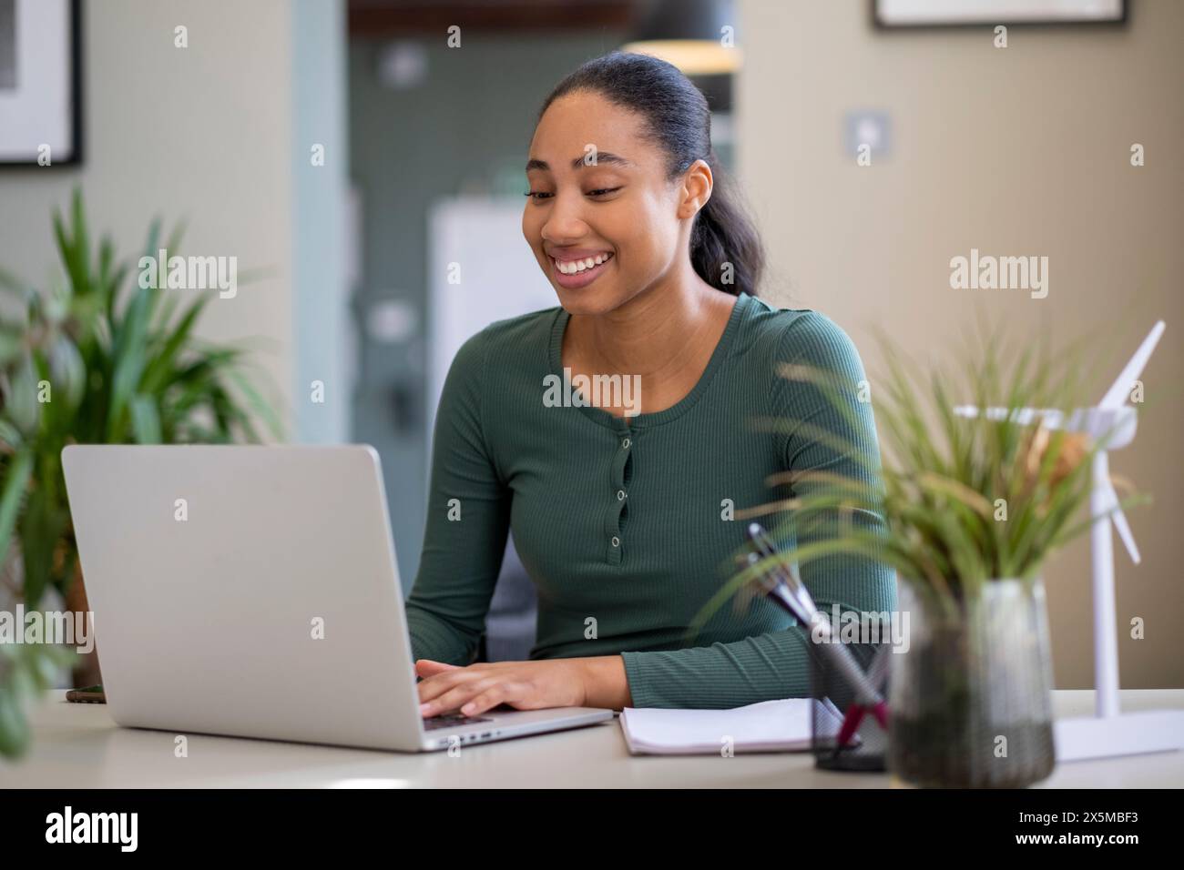 Young engineer working on laptop in office Stock Photo - Alamy