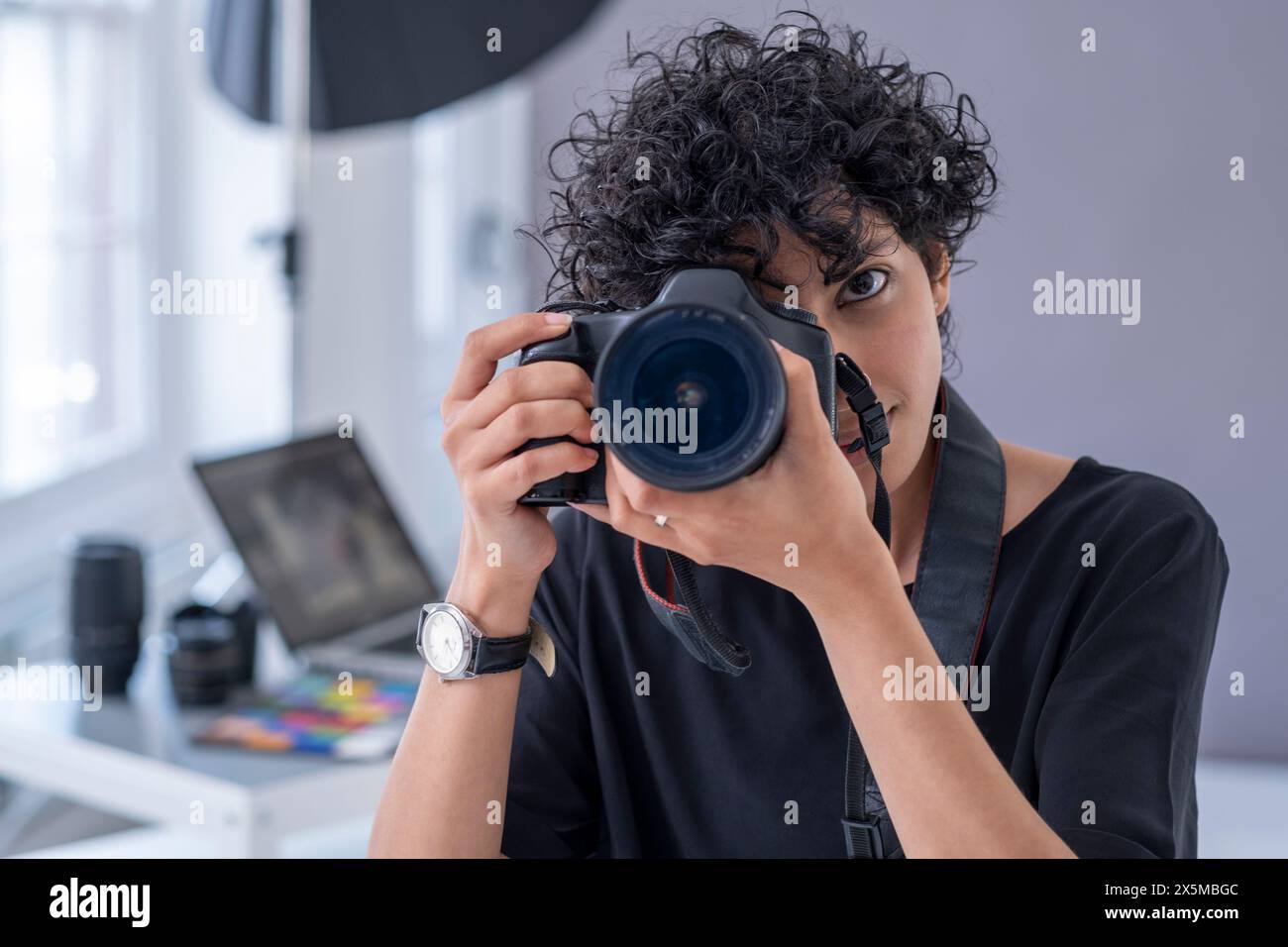 Female photographer taking photos with digital camera Stock Photo - Alamy