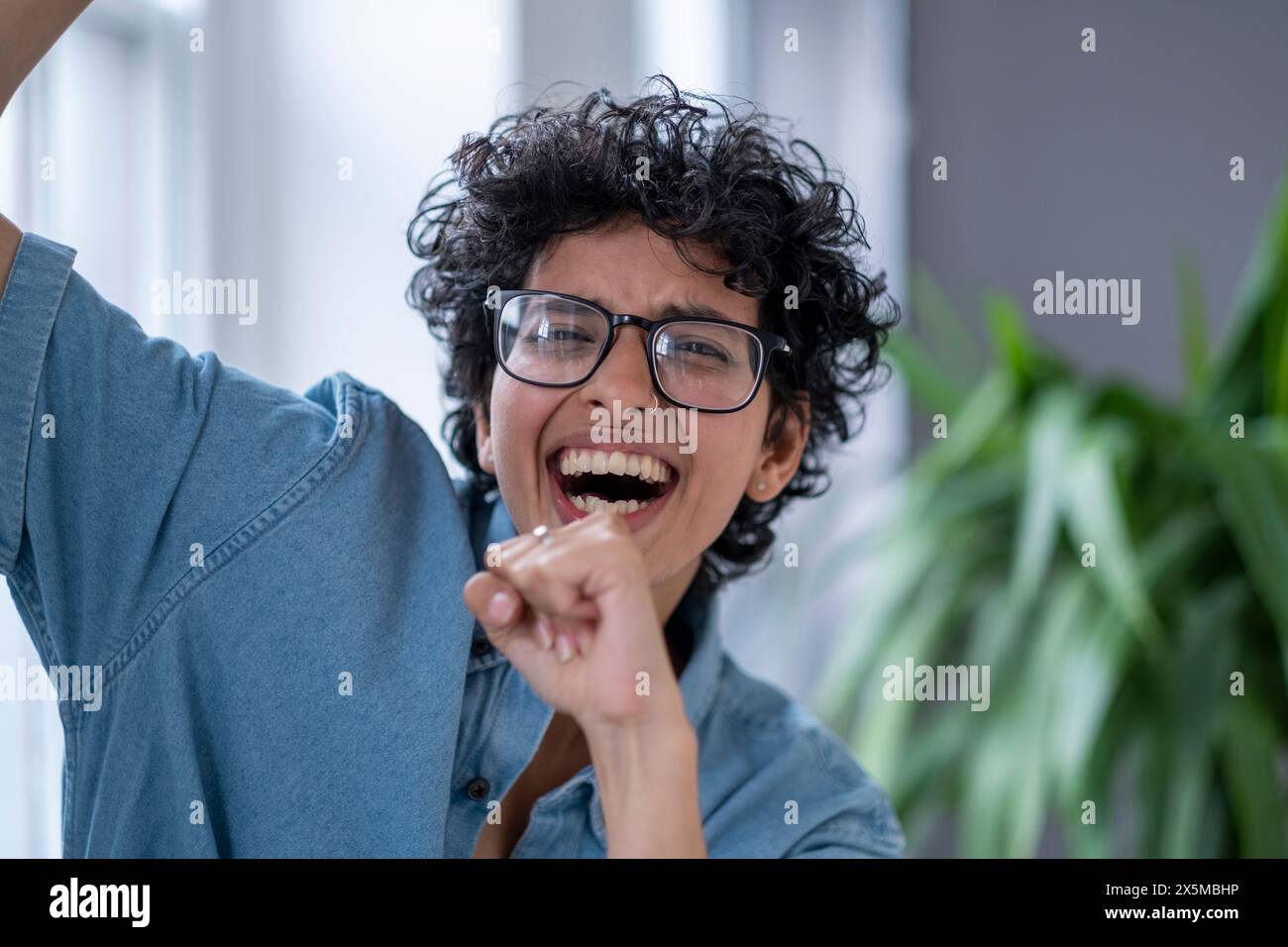 Curly woman cheering hi-res stock photography and images - Alamy