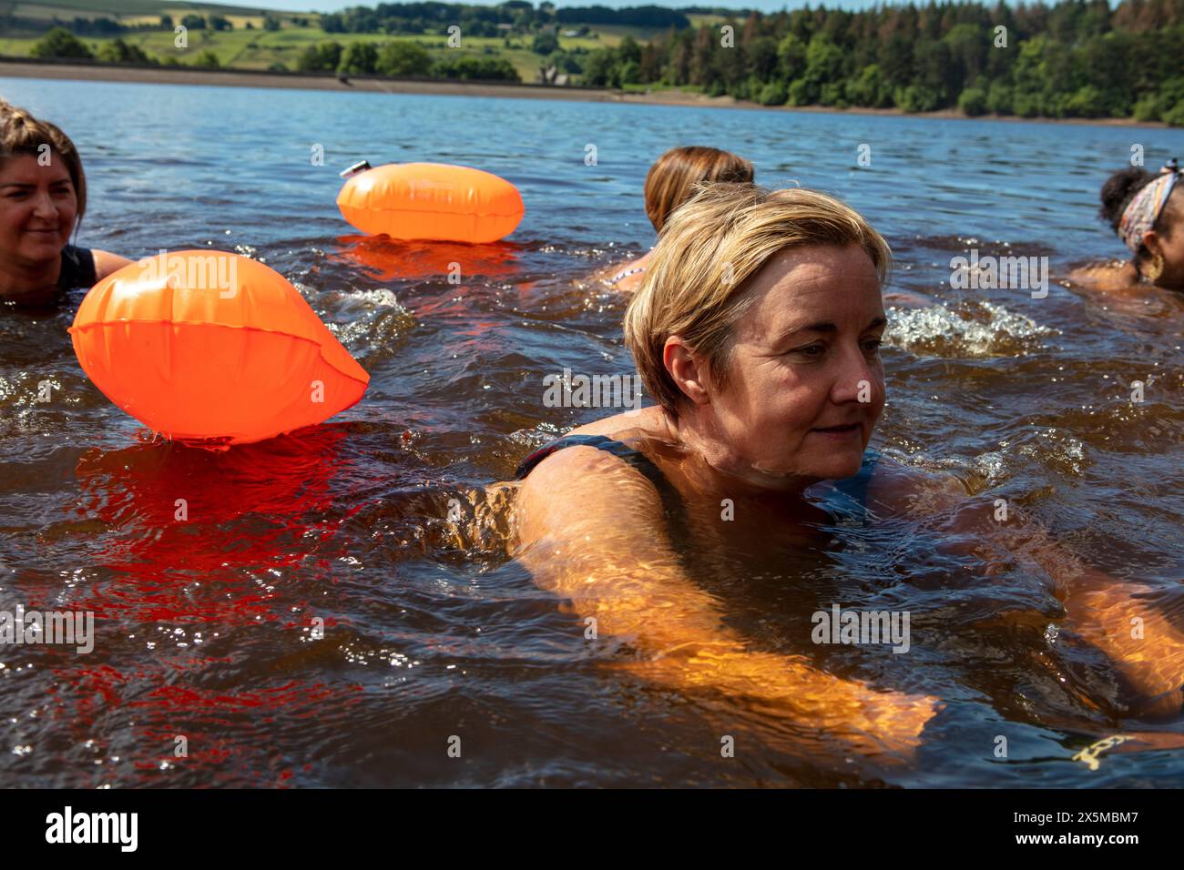 Female friends swimming in lake, Yorkshire, UK Stock Photo - Alamy